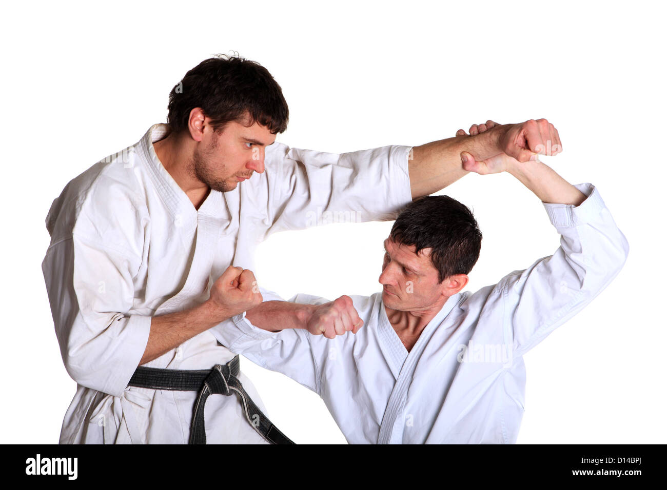 Karate. Men in a kimono with a white background. Battle sports capture ...
