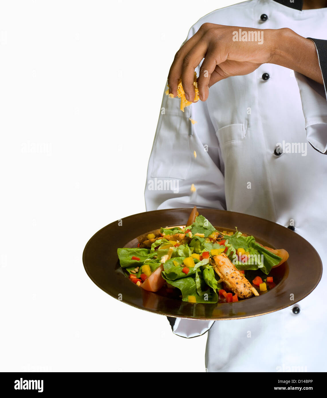 Chef sprinkling cheese on healthy salad isolated on white Stock Photo ...