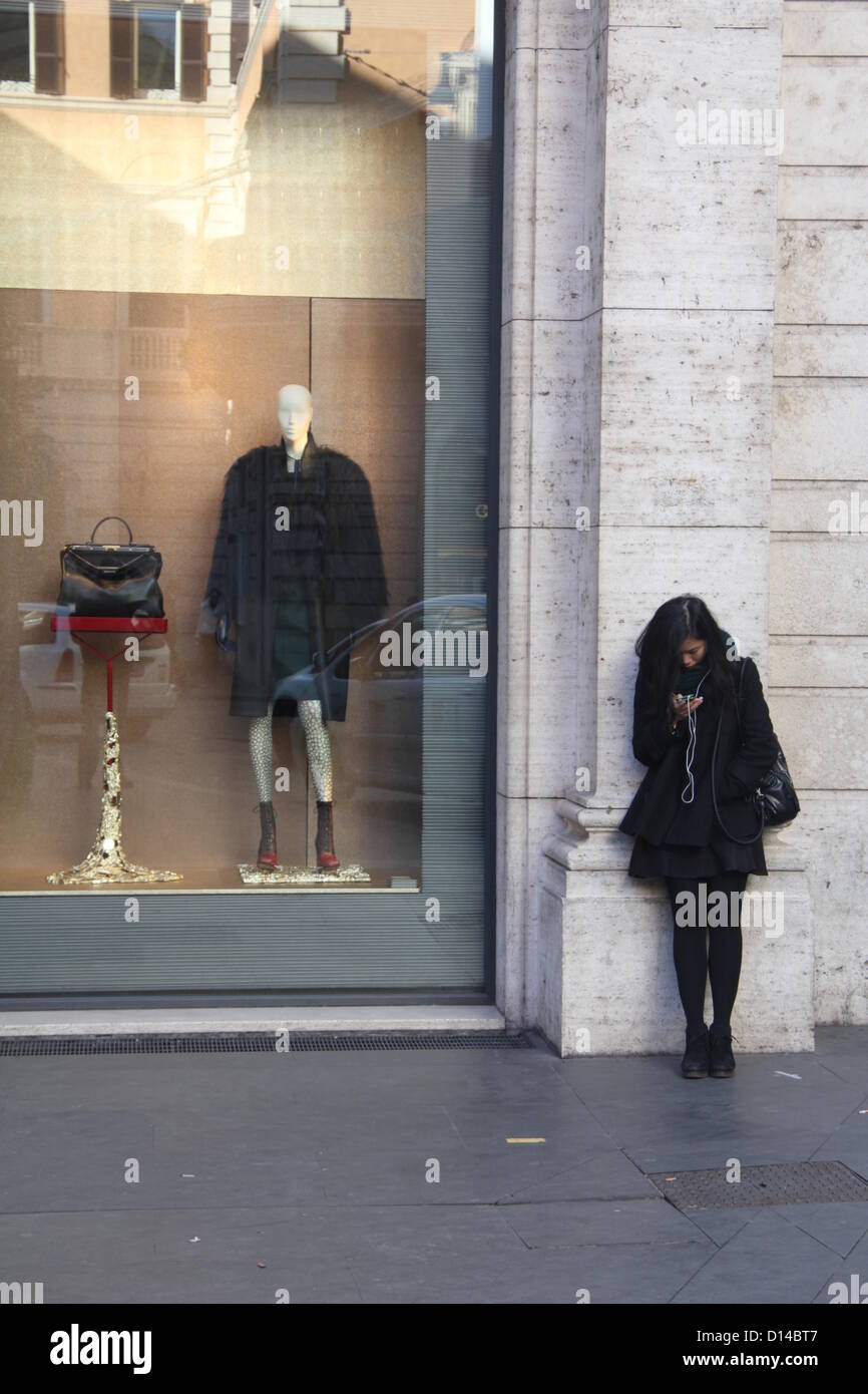 6 Dec 2012 Woman standing outside Fendi shop in rome italy Stock Photo ...