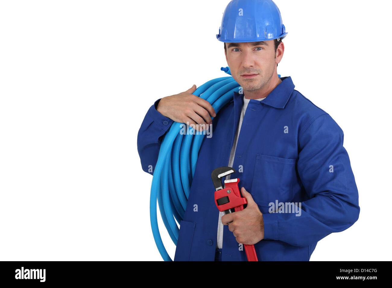 Workers with blue tube roll Stock Photo - Alamy