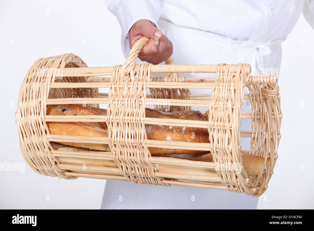 Baker carrying fresh bread hi-res stock photography and images - Alamy
