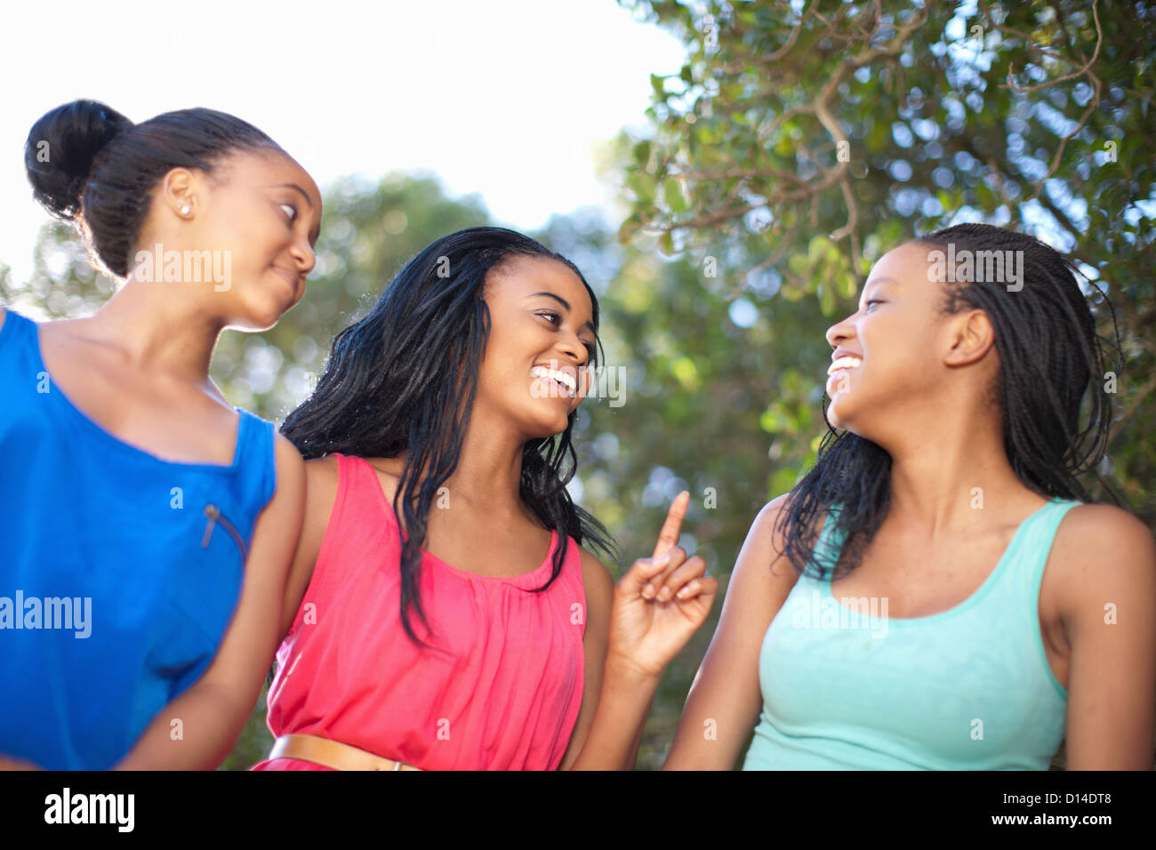 Smiling women walking outdoors Stock Photo - Alamy