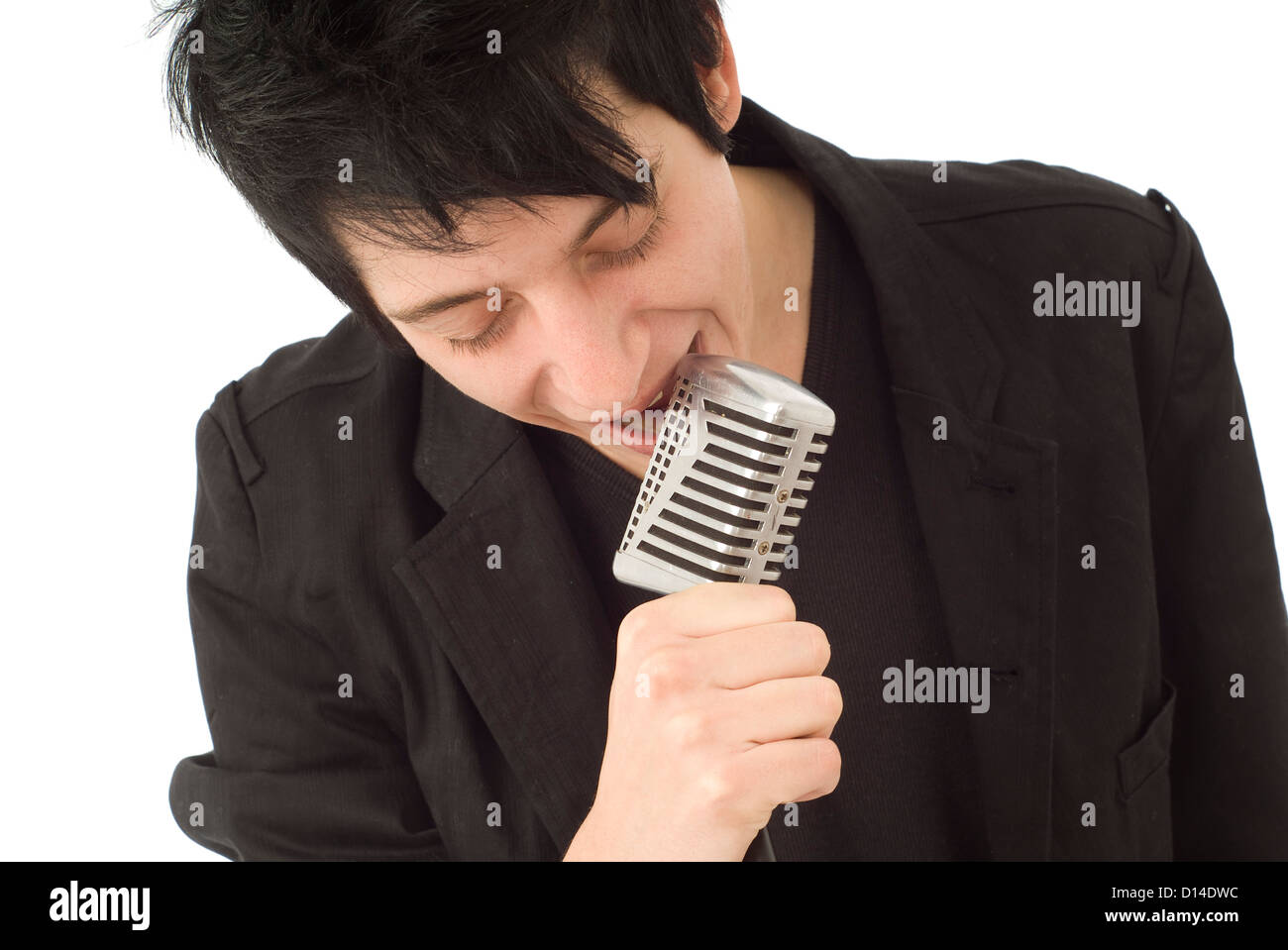 Young man rock or pop singer with microphone isolated on white Stock ...