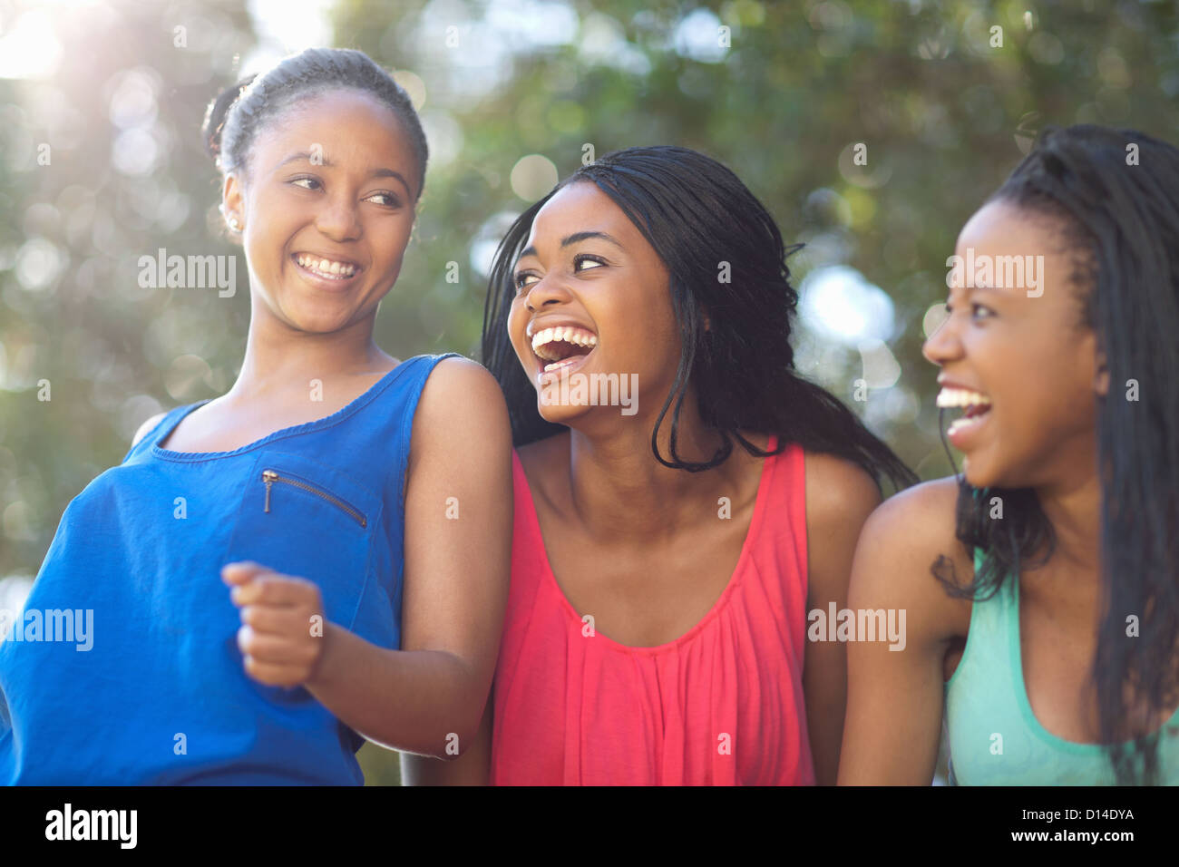 Smiling women walking outdoors Stock Photo - Alamy