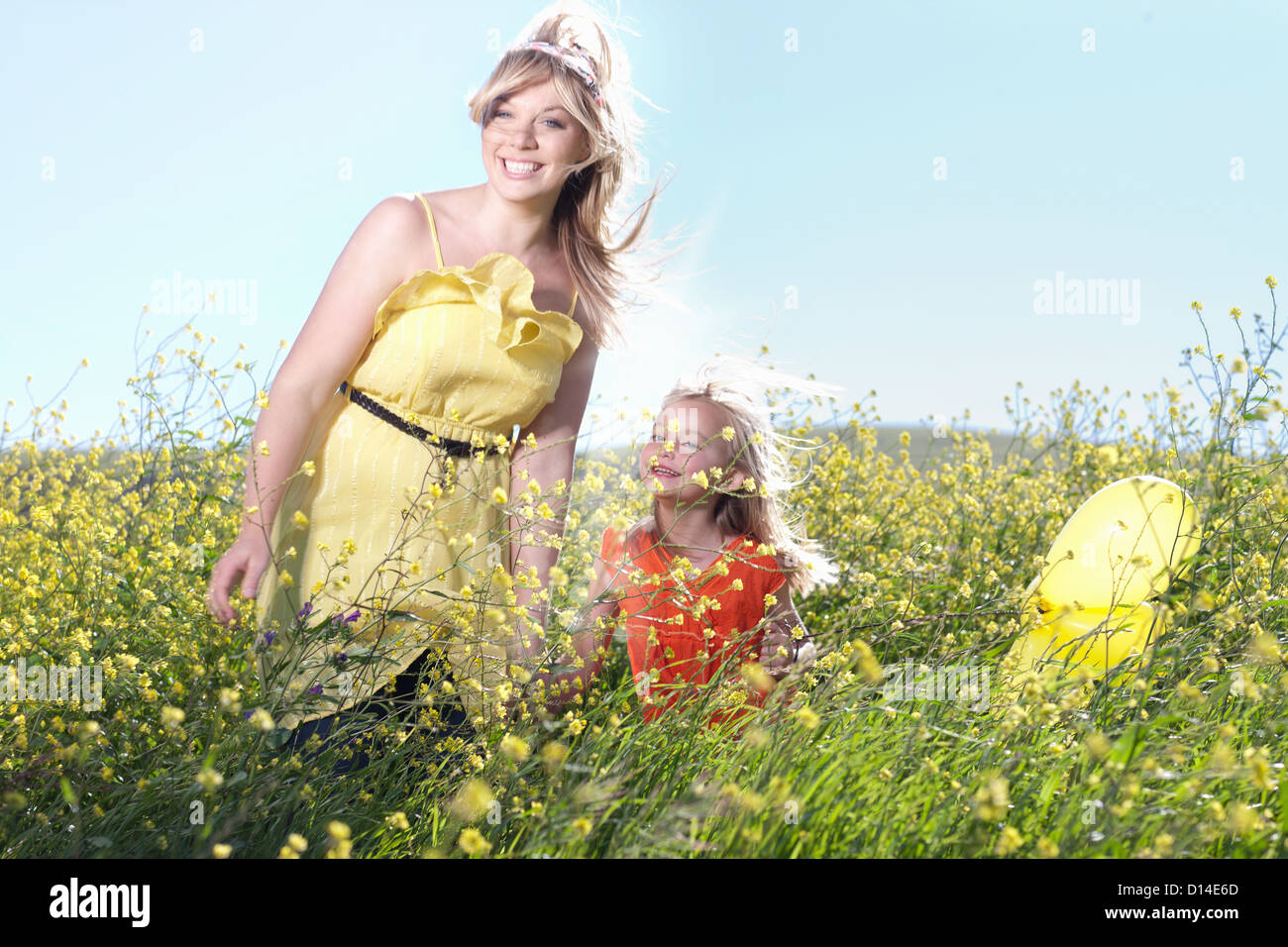 Sisters playing in field flowers hi-res stock photography and images ...