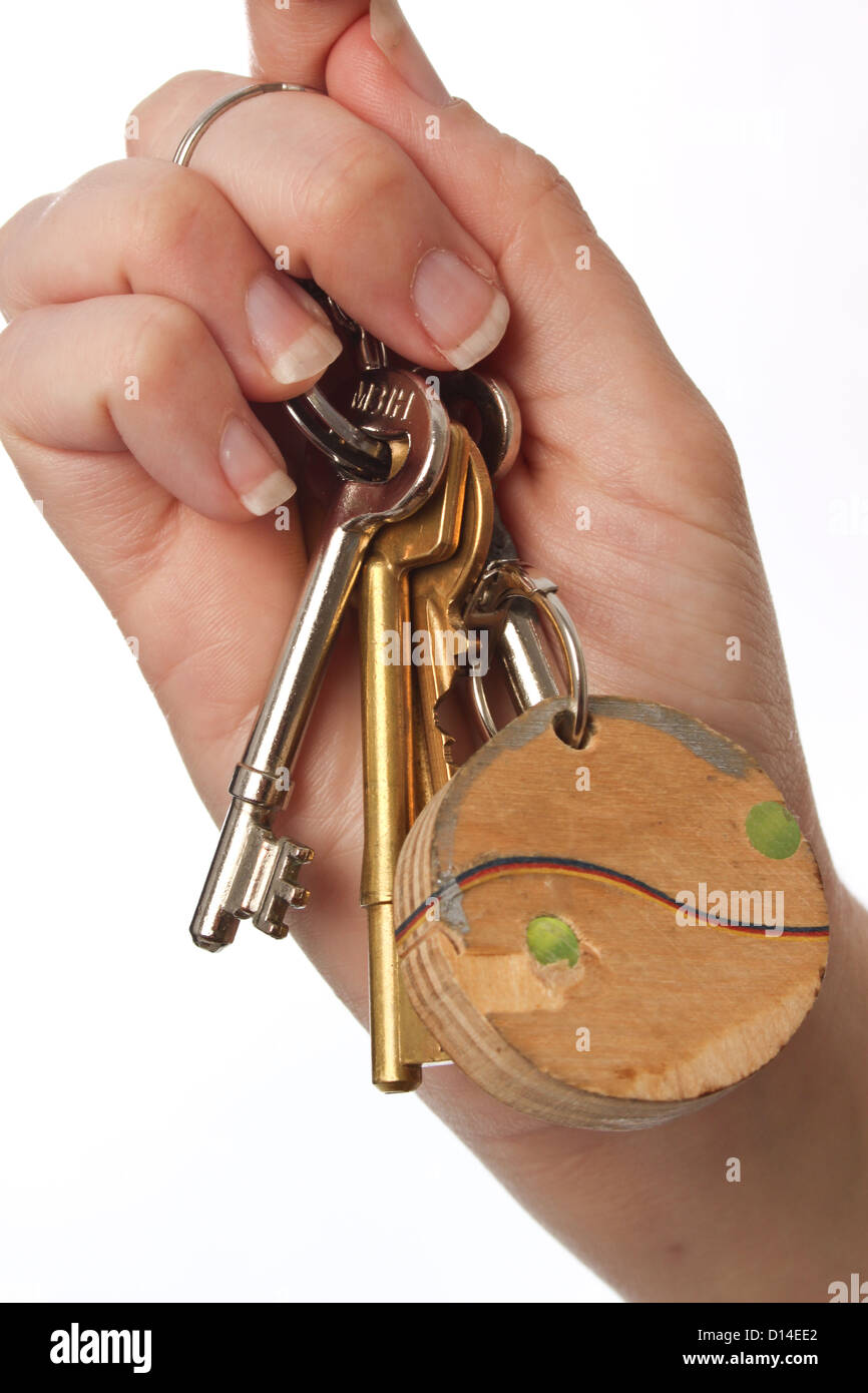Hand dangling keys hi-res stock photography and images - Alamy