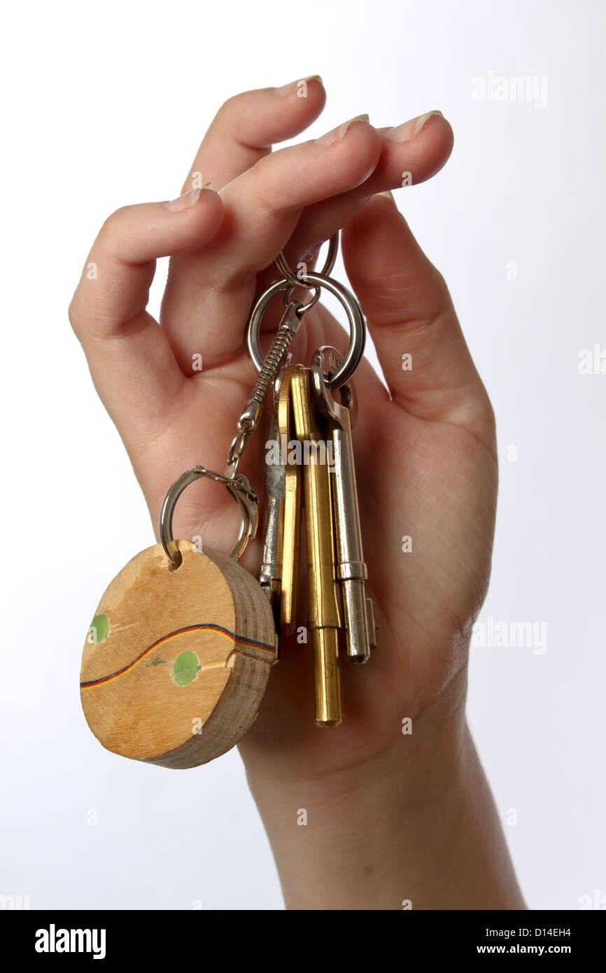 Hand dangling keys hi-res stock photography and images - Alamy