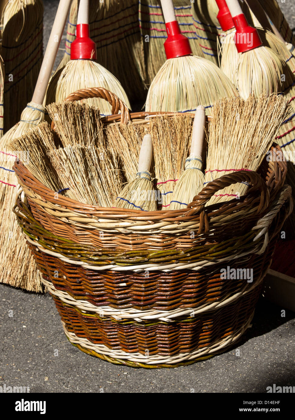 big and small brooms in the basket Stock Photo - Alamy