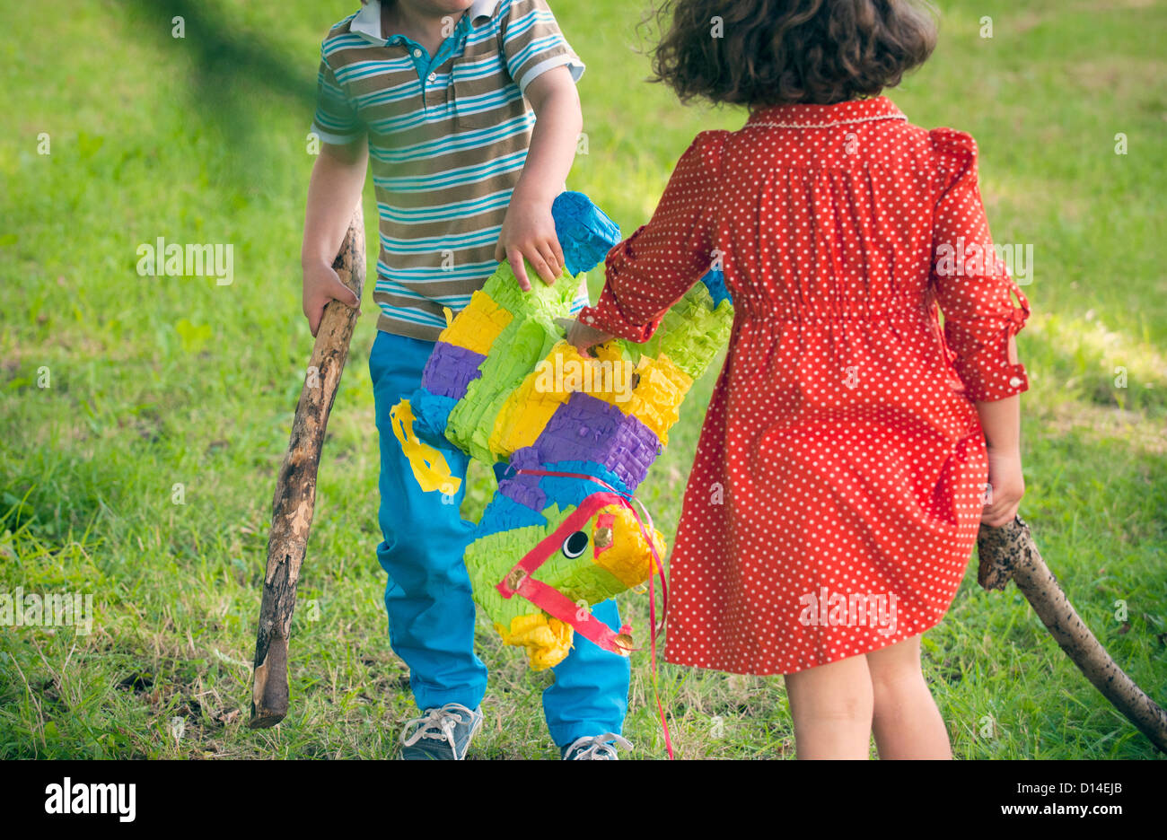 Children opening pinata at party Stock Photo - Alamy