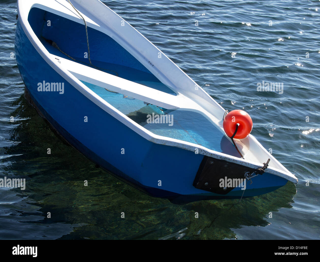 small plastic boat sinking after storm Stock Photo - Alamy