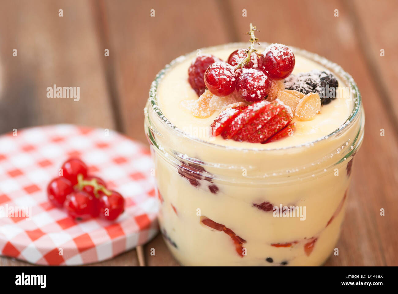 Pot of custard with fruit Stock Photo - Alamy