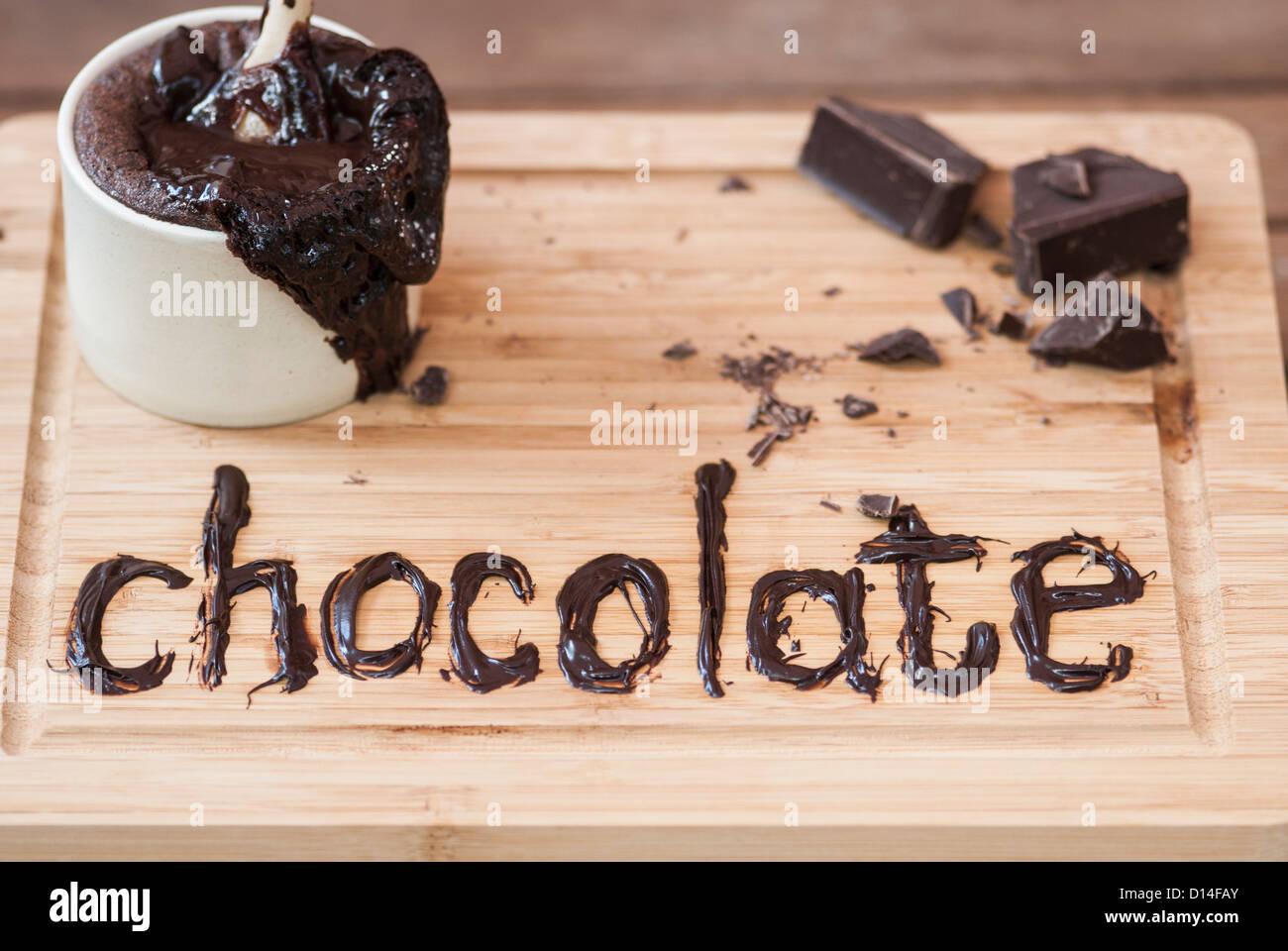 Chocolate written on cutting board Stock Photo - Alamy