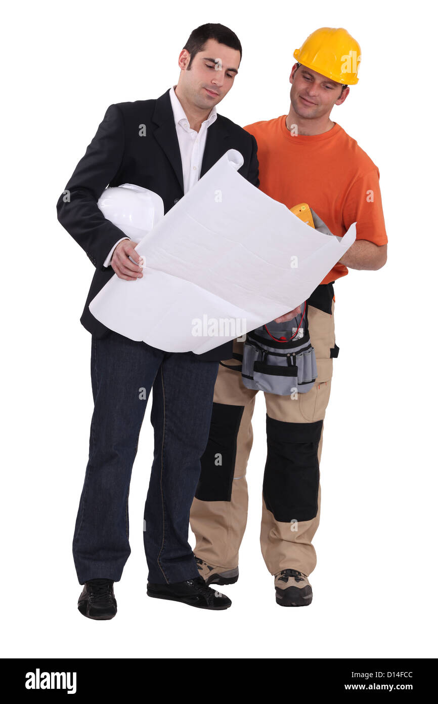 Tradesman and engineer working together Stock Photo - Alamy