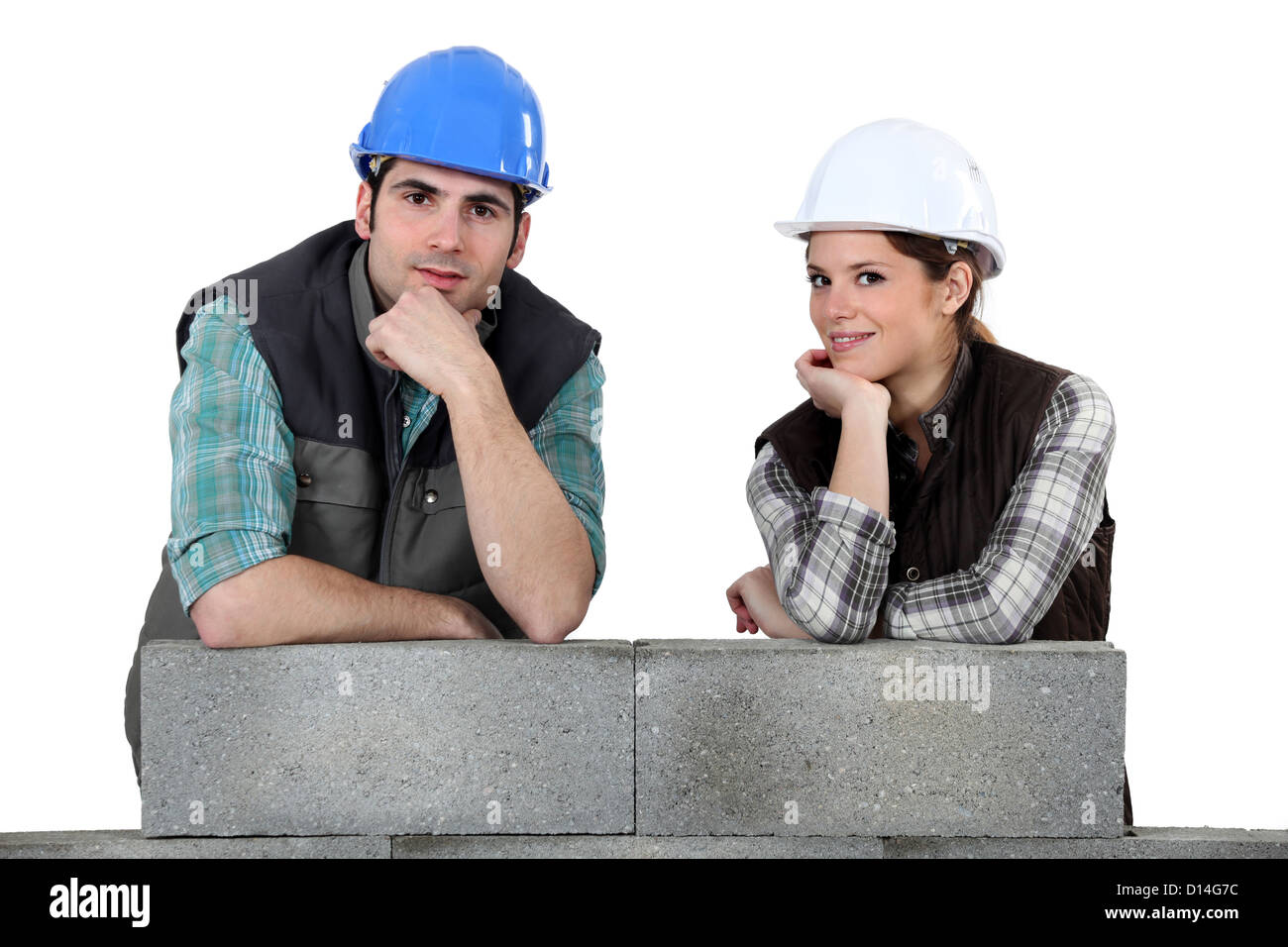 Couple building wall Stock Photo - Alamy