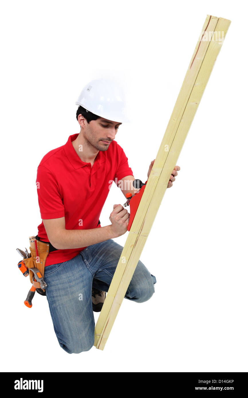 A carpenter using a plane Stock Photo - Alamy