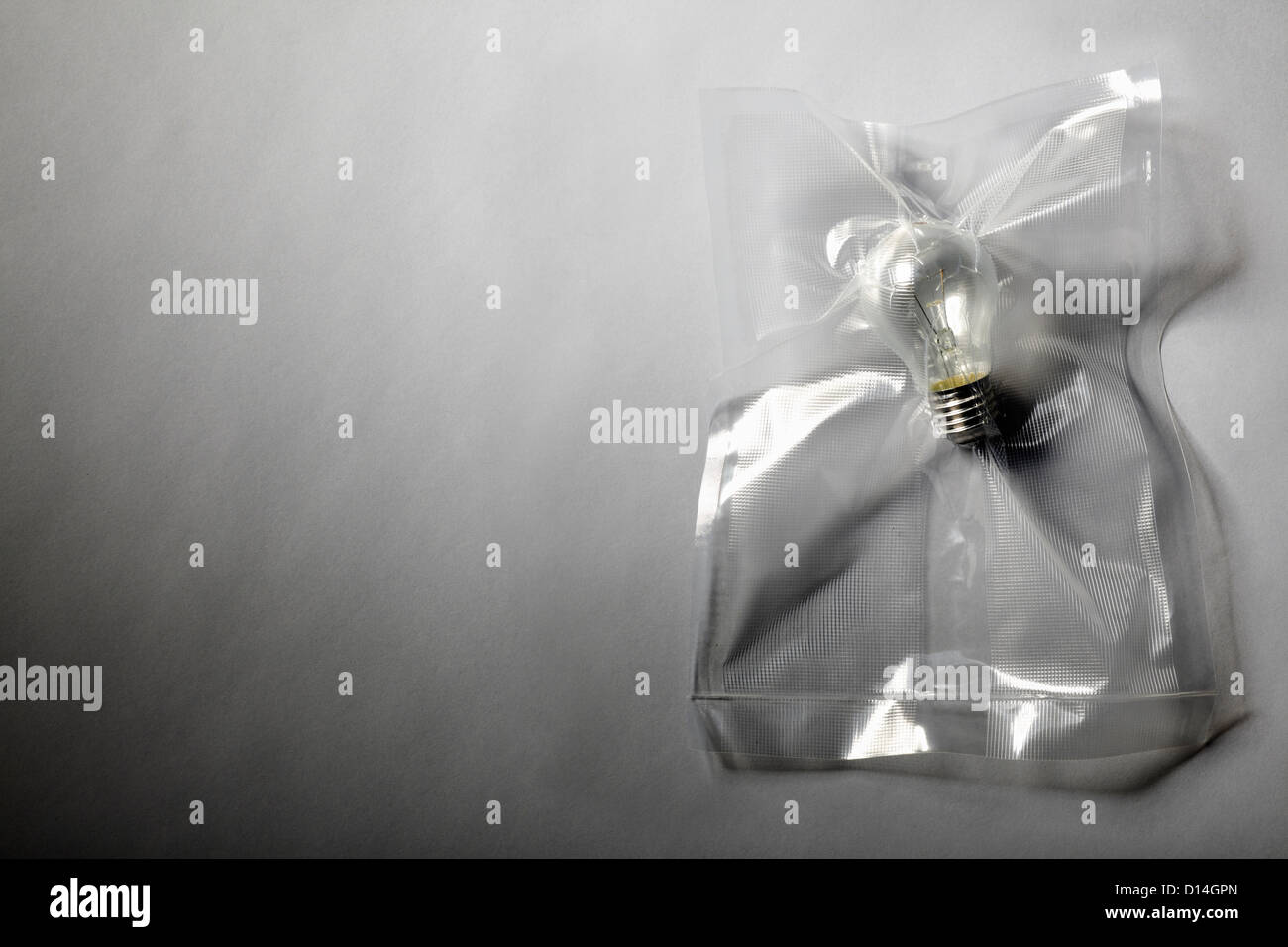 Light bulb shrink wrapped in plastic Stock Photo - Alamy