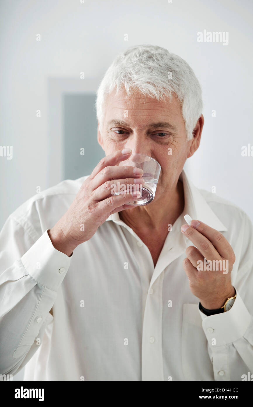 ELDERLY PERSON TAKING MEDICATION Stock Photo - Alamy
