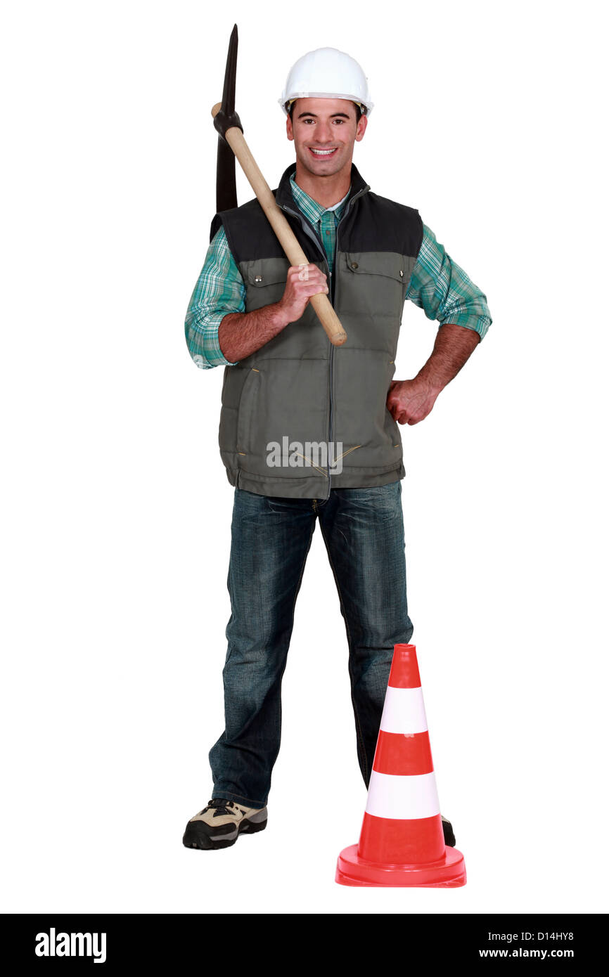 Construction worker with a pickaxe Stock Photo - Alamy