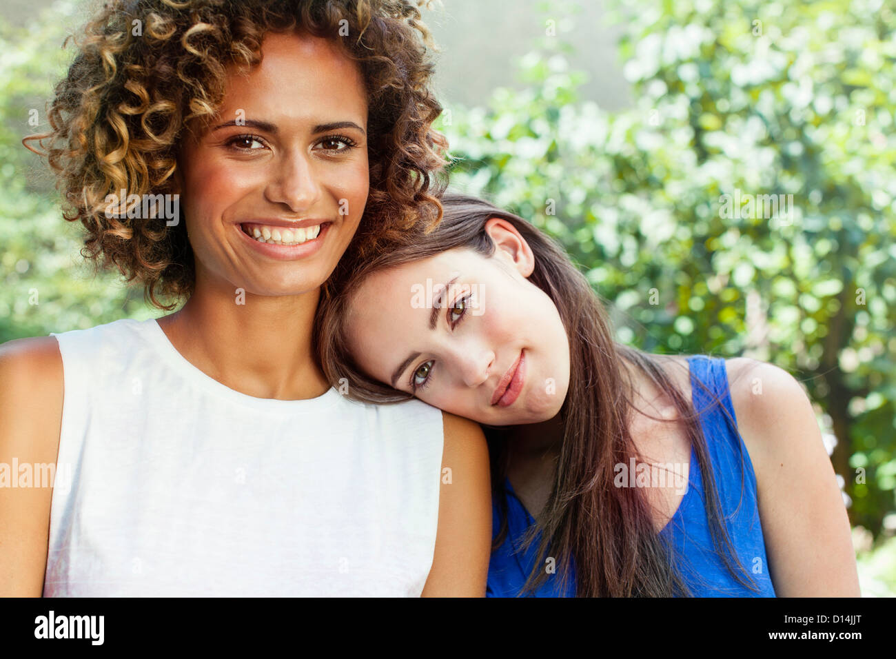 Smiling women sitting together Stock Photo - Alamy Smiling women sitting together Stock Photo - Alamy