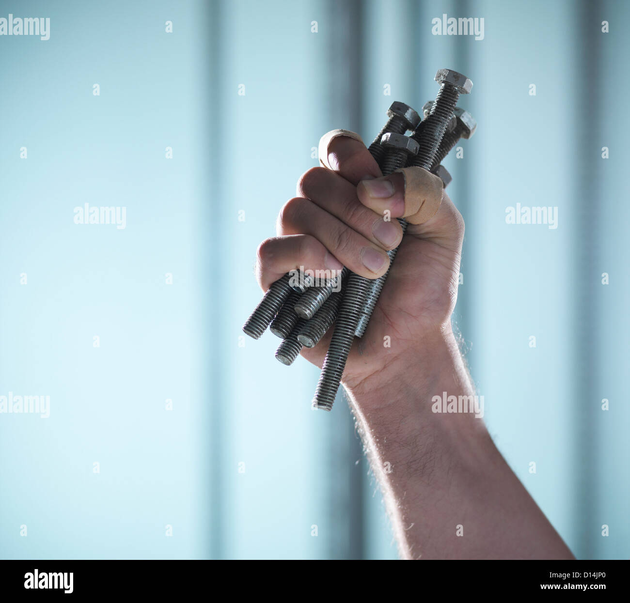 Hand holding screws hi-res stock photography and images - Alamy