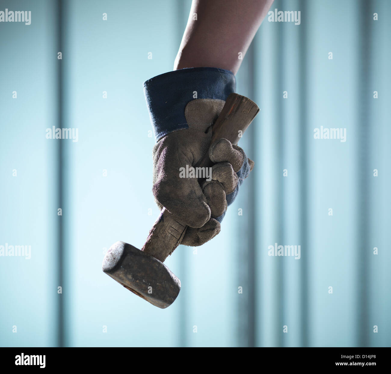 Close up of hand holding mallet Stock Photo - Alamy