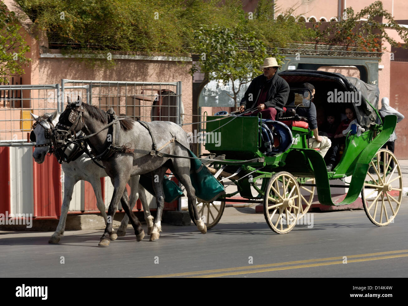 Tourists in a horse and carriage in Marrakesh, Morocco Stock Photo - Alamy
