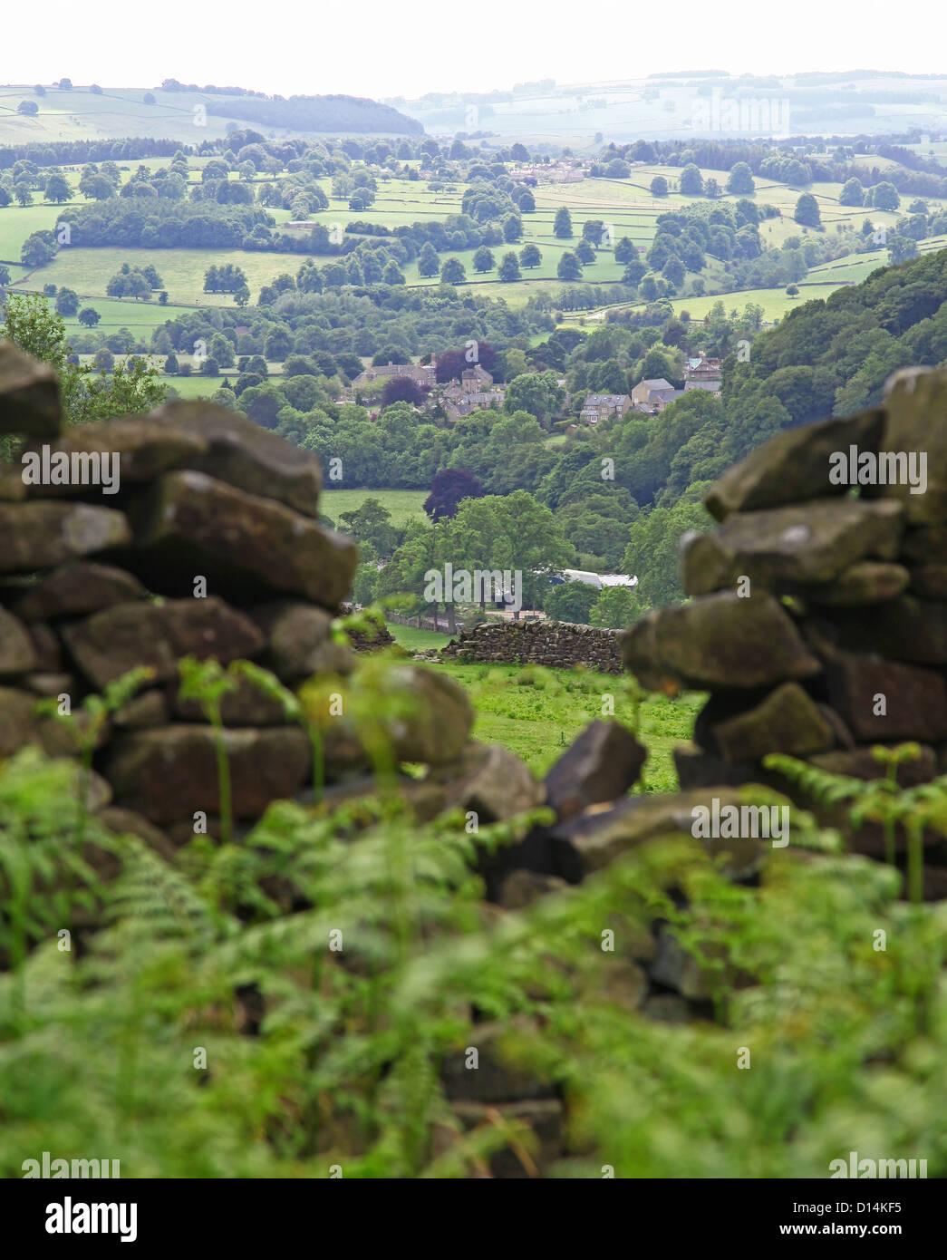 Baslow village seen from near Gardom's Edge through a dry stone wall ...