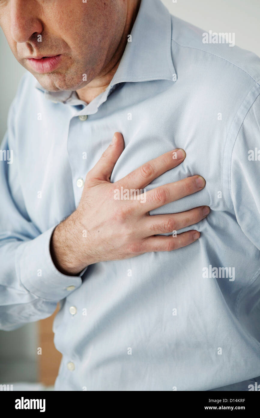MAN WITH HEART ATTACK Stock Photo - Alamy