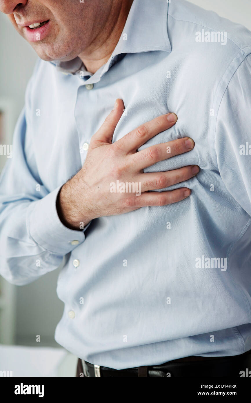 MAN WITH HEART ATTACK Stock Photo - Alamy