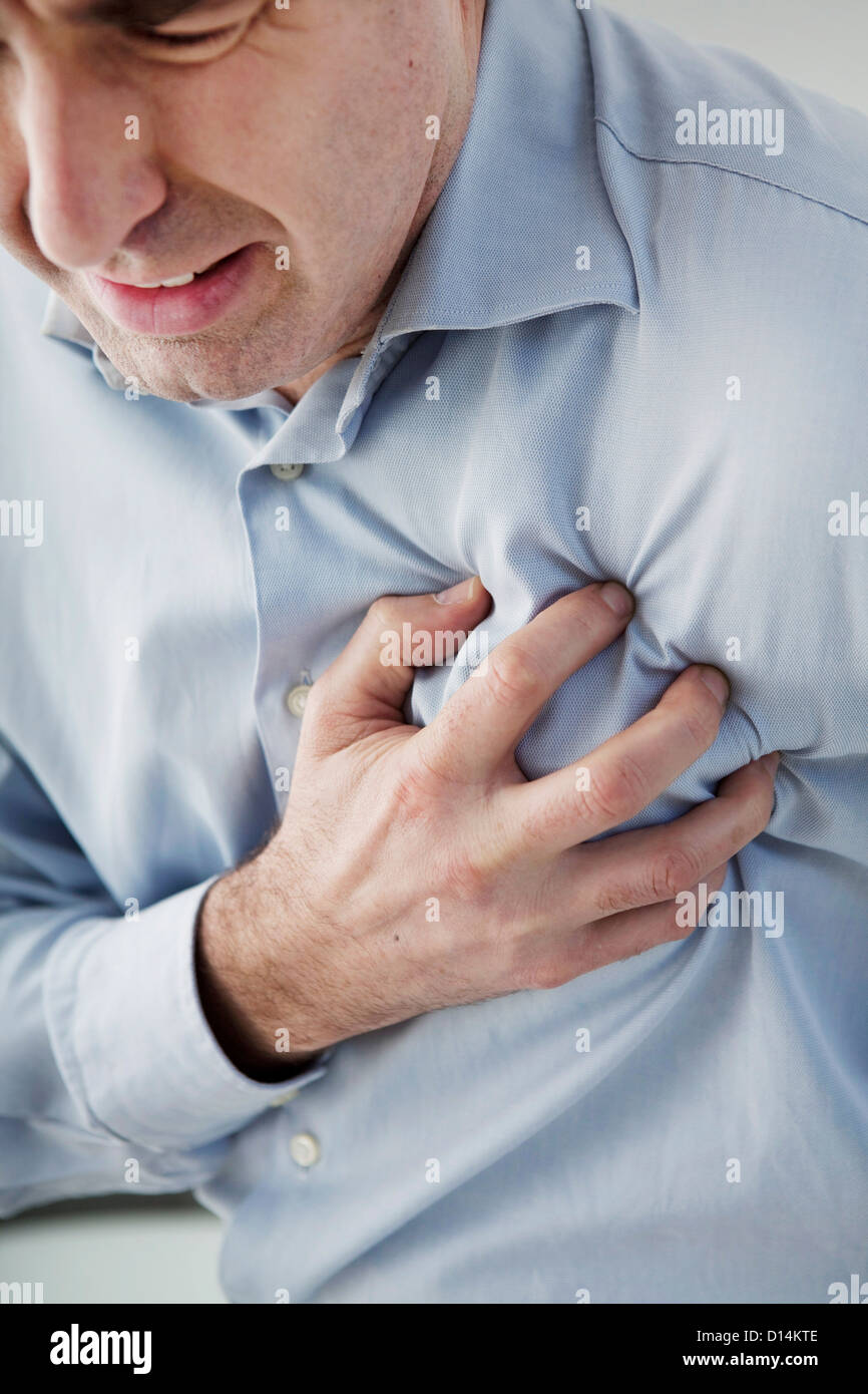 MAN WITH HEART ATTACK Stock Photo - Alamy