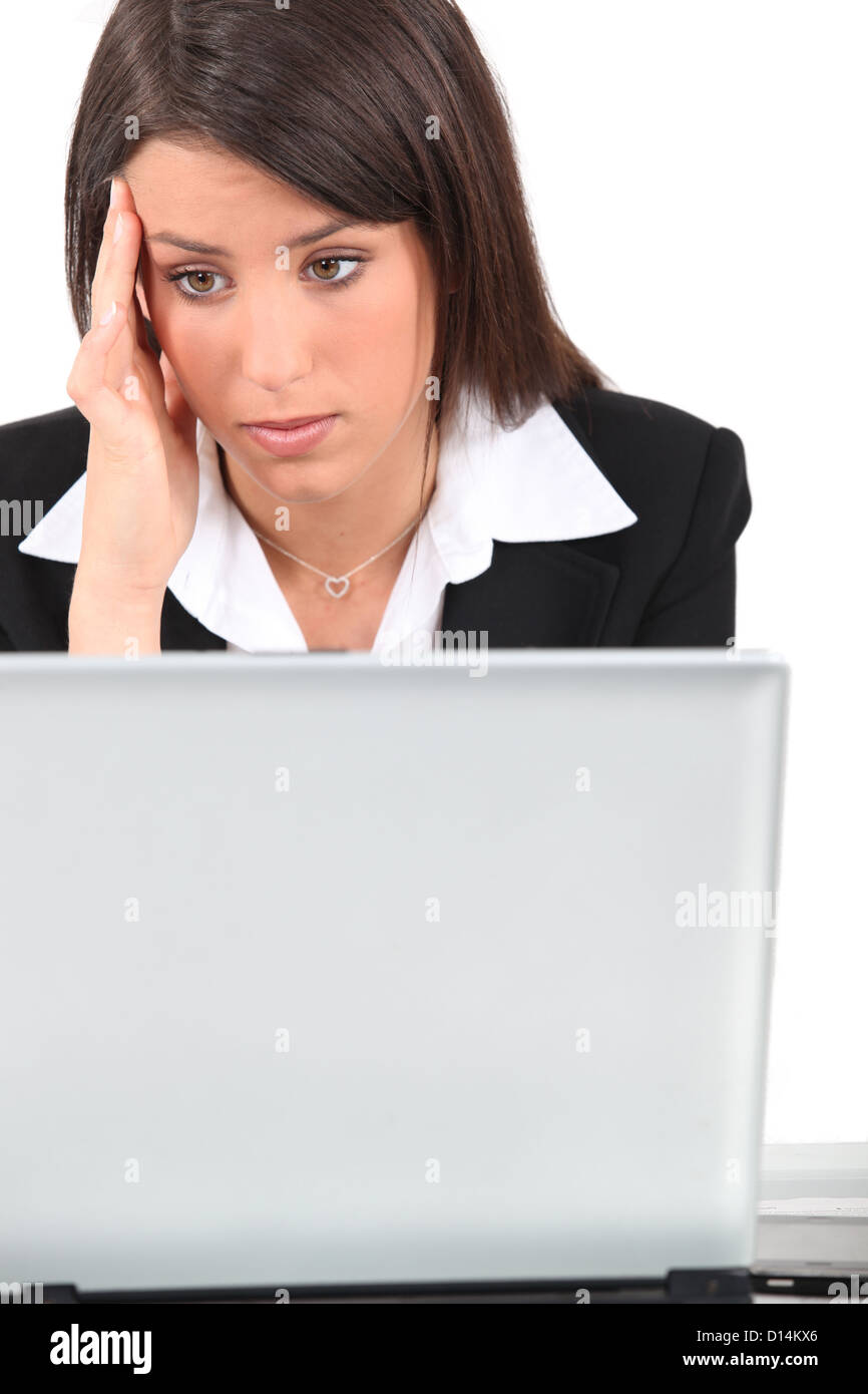 Bored woman in front of computer Stock Photo - Alamy