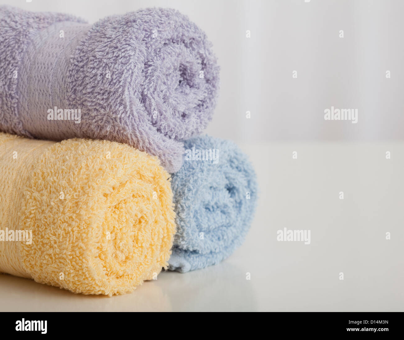 Studio shot of rolled up of pastel colored towels Stock Photo - Alamy