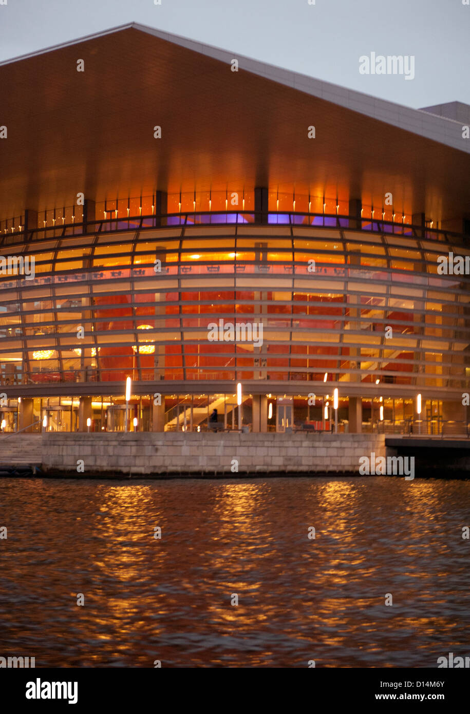 Copenhagen's opera house on the harbour waterfront at dusk in winter ...