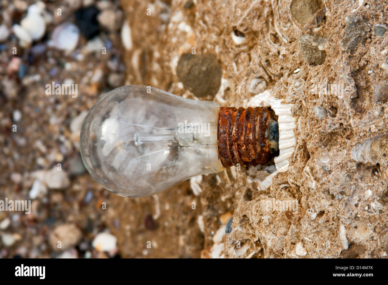 Rusty light bulb on sea stone background Stock Photo - Alamy