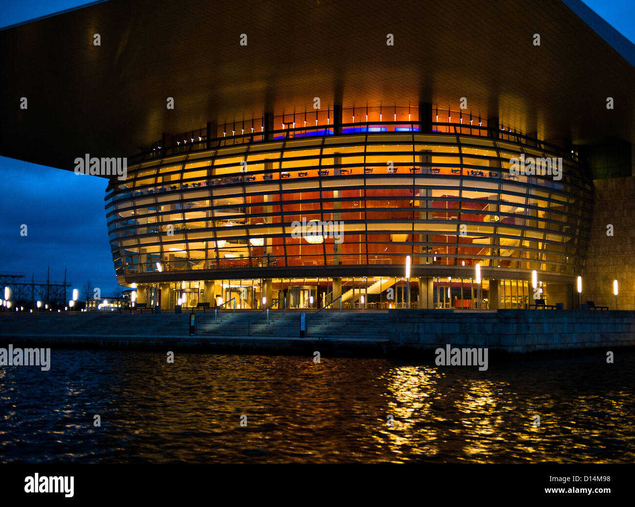 Copenhagen's opera house on the harbour waterfront at dusk in winter ...