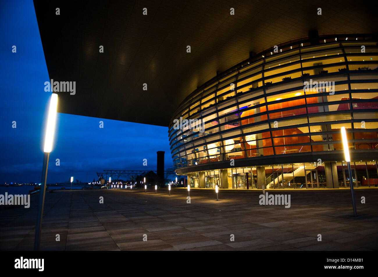 Copenhagen's opera house on the harbour waterfront at dusk in winter ...
