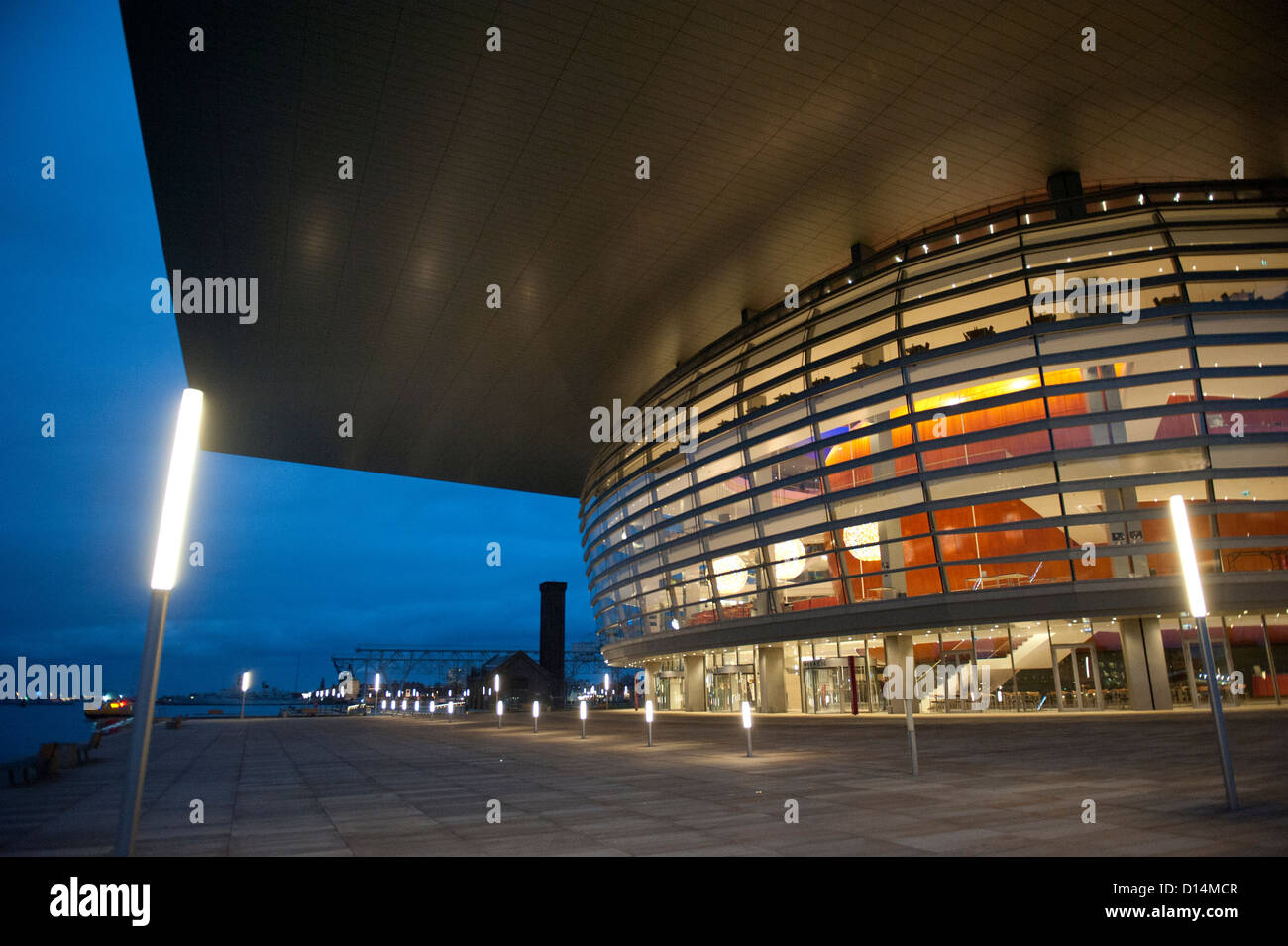 Copenhagen's opera house on the harbour waterfront at dusk in winter ...