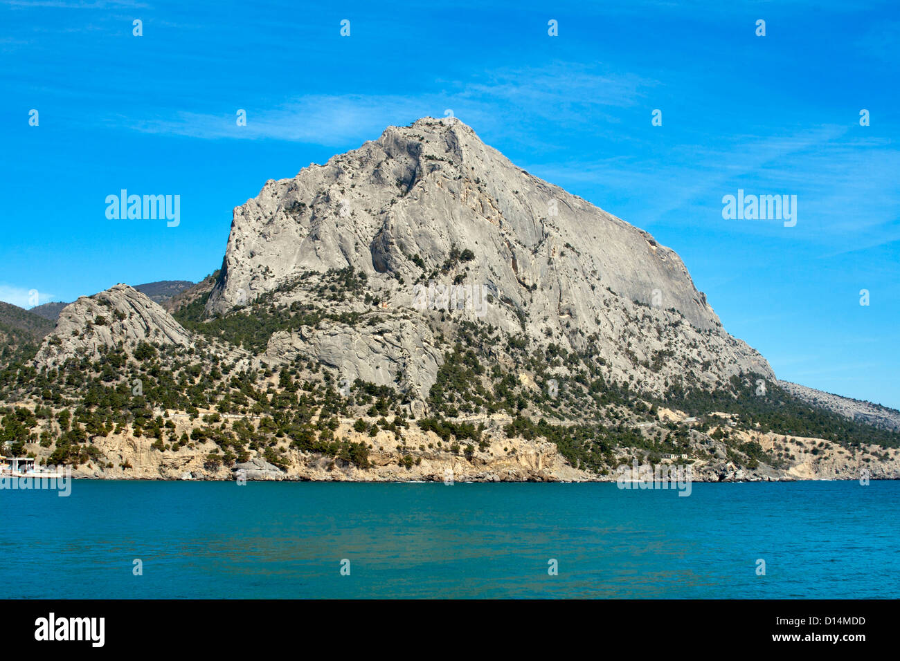 Sokol (Falcon) mountain in Crimea, Ukraine. Rocky coastline on blue sky ...