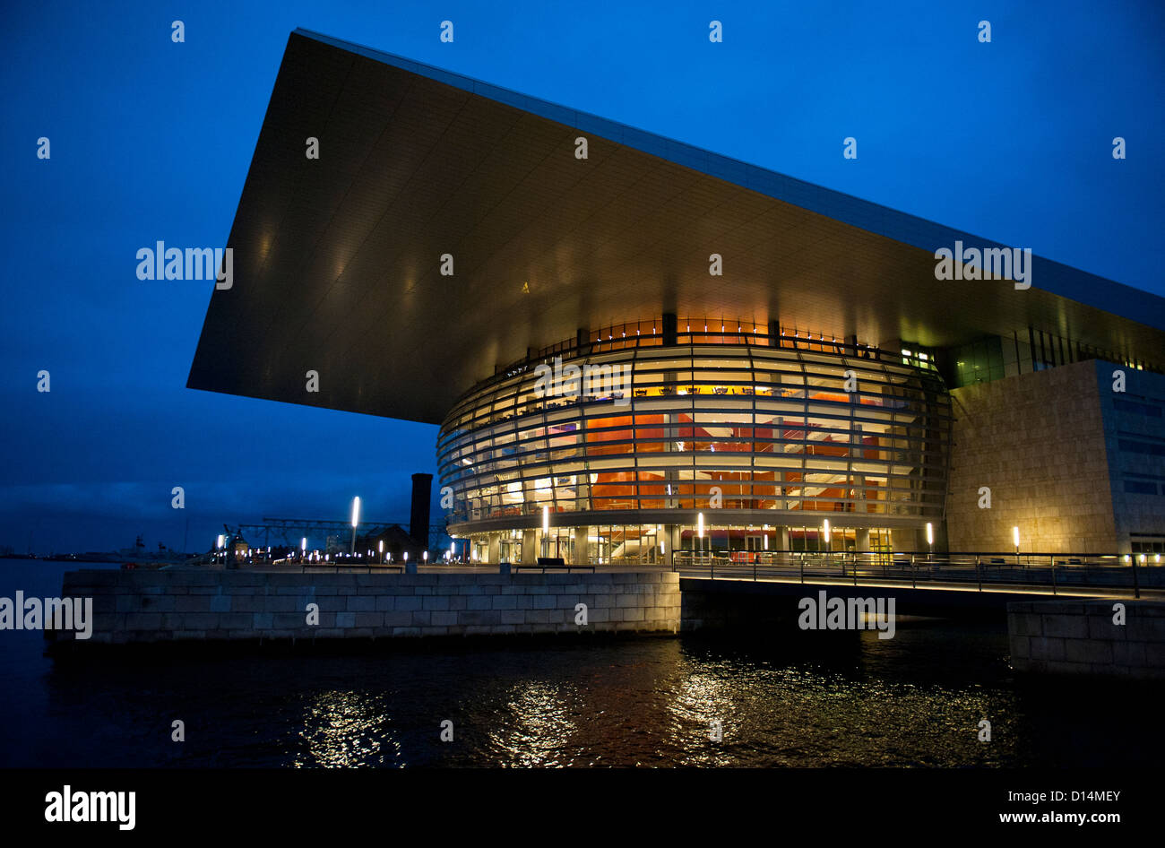 Copenhagen's opera house on the harbour waterfront at dusk in winter ...