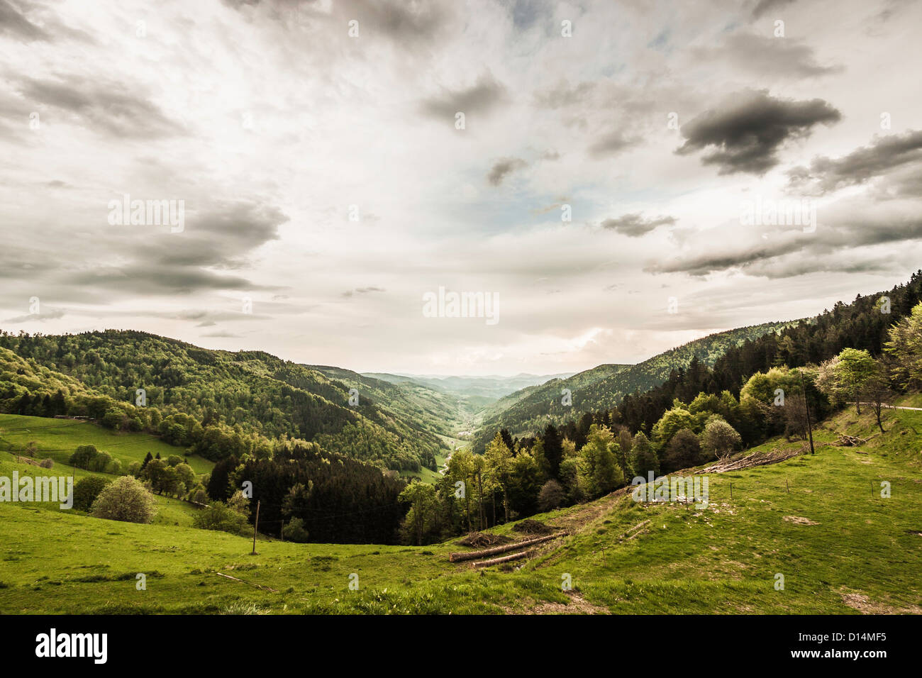 Clouds over grassy rural landscape Stock Photo - Alamy