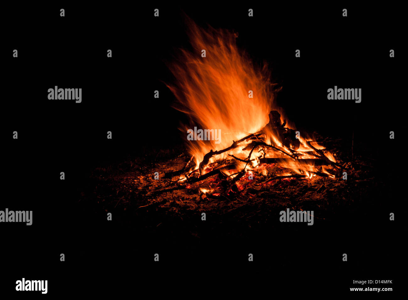 Fire burning outdoors at night Stock Photo - Alamy