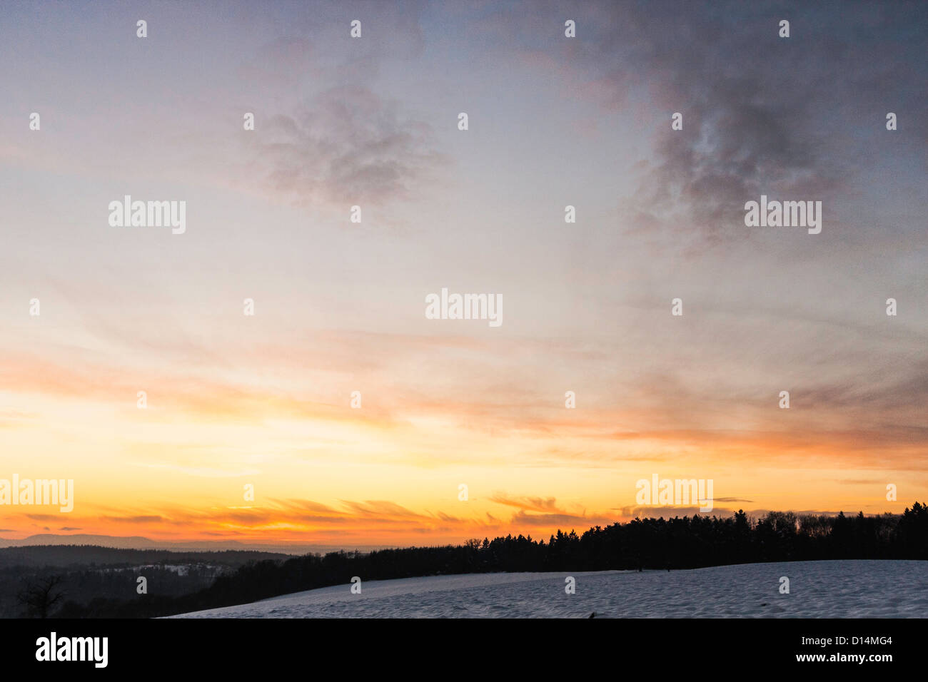 Sun setting over rural landscape Stock Photo - Alamy