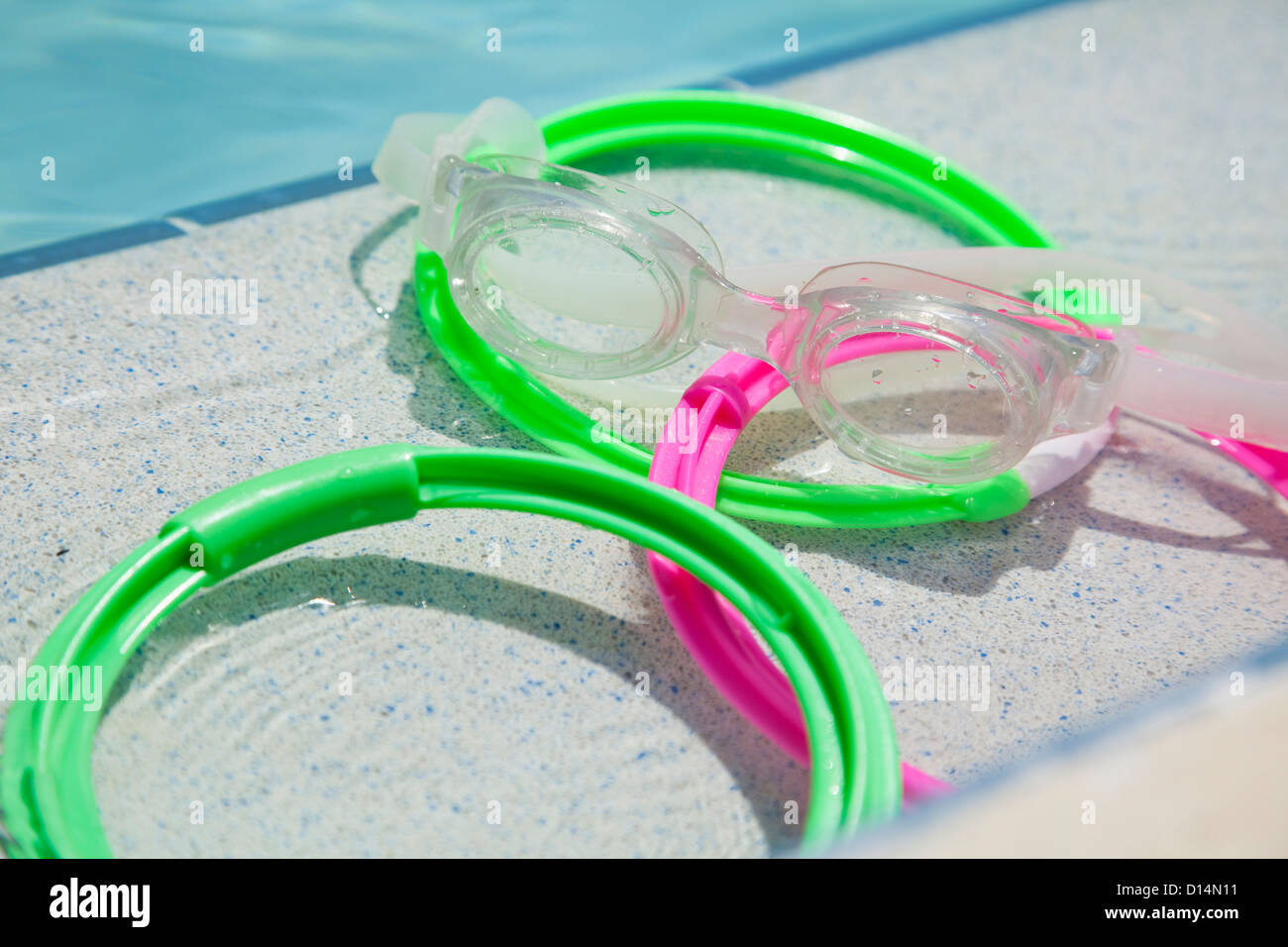 USA, Florida, St. Petersburg, goggles and rings on poolside Stock Photo ...