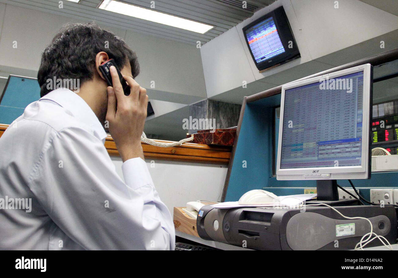 Stockbroker busy on call during a trading session at the Karachi Stock ...