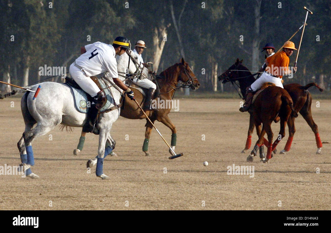 Polo players chase ball during Polo Final match between FC Headquarters ...