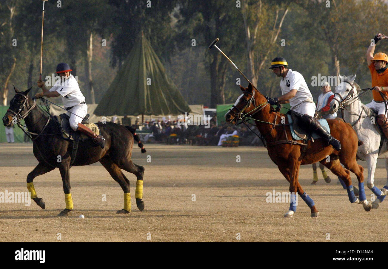 Polo players chase ball during Polo Final match between FC Headquarters ...