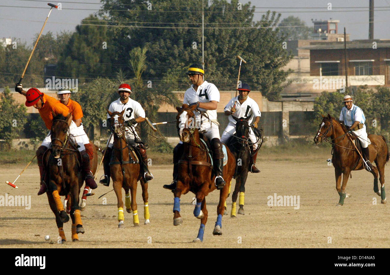 Polo players chase ball during Polo Final match between FC Headquarters ...