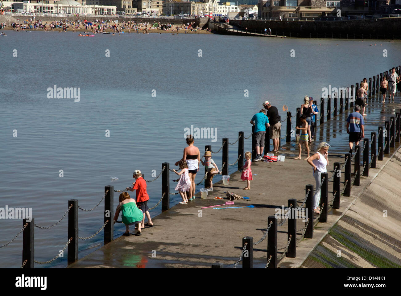 People on the causeway to Knightstone Island Weston Super Mare Somerset ...