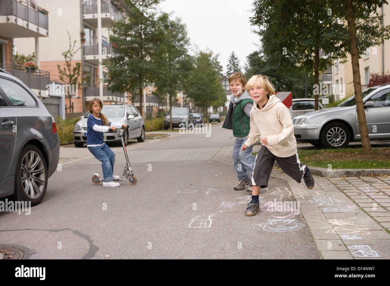 Children playing on suburban street Stock Photo - Alamy