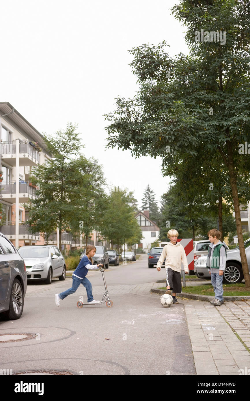 Children playing on suburban street Stock Photo - Alamy